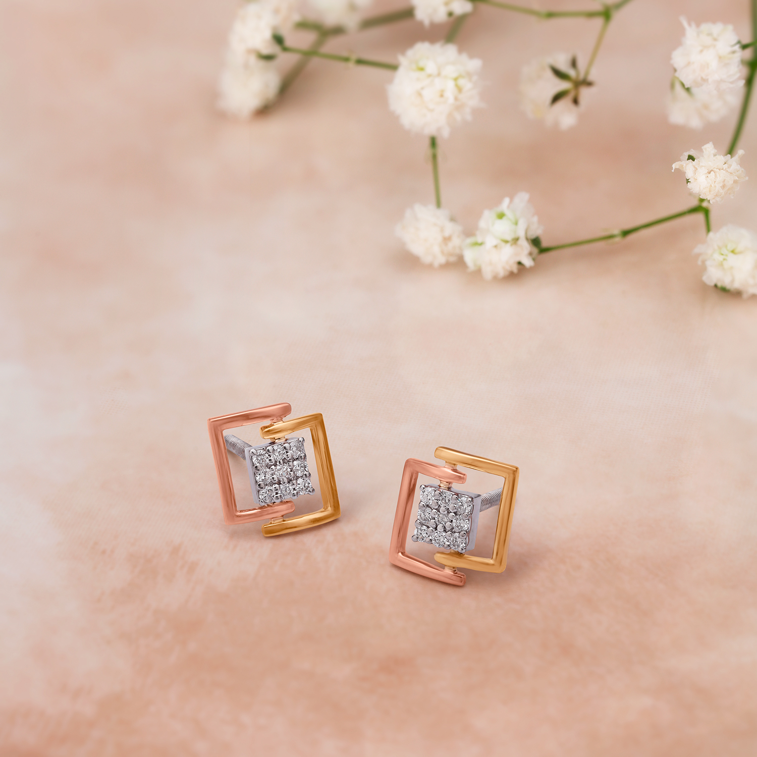 Buy Voguish Diamond Stud Earrings with a unique design crafted in 18 ...