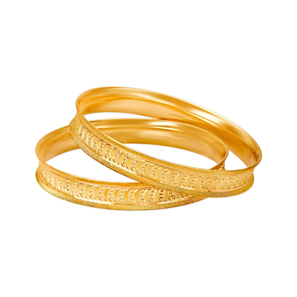 Buy Mystical Yellow Gold Etched Crescent Bangles at Best Price | Tanishq US
